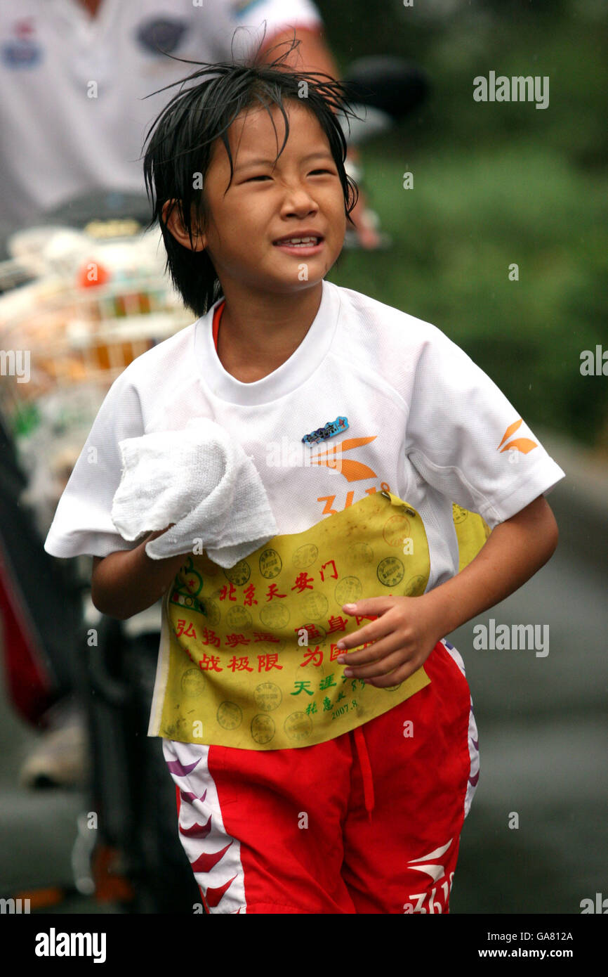 Eight-Year-Old Child Runs Across China Stock Photo - Alamy