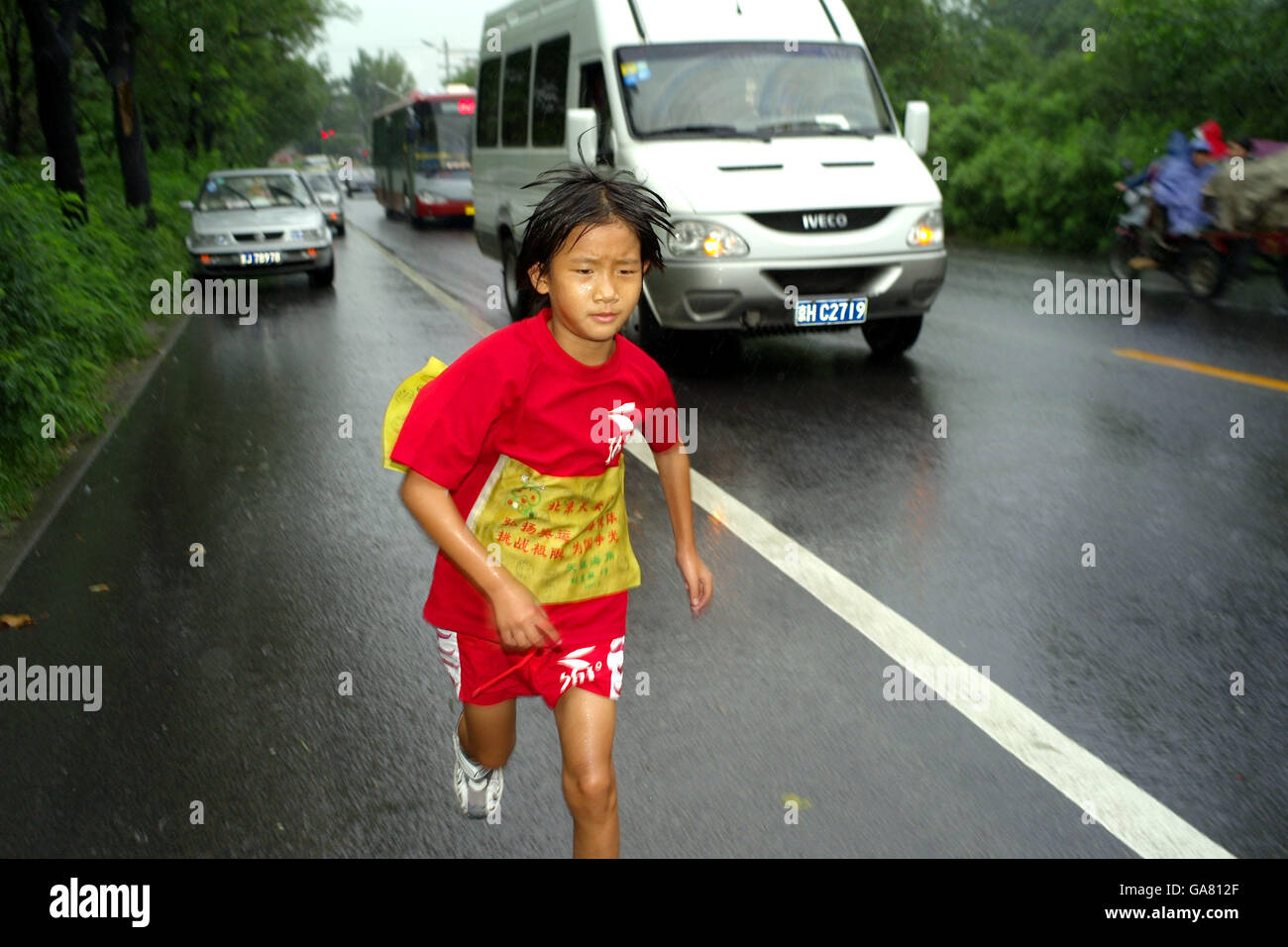 Eight year old child runs across china hi-res stock photography and ...