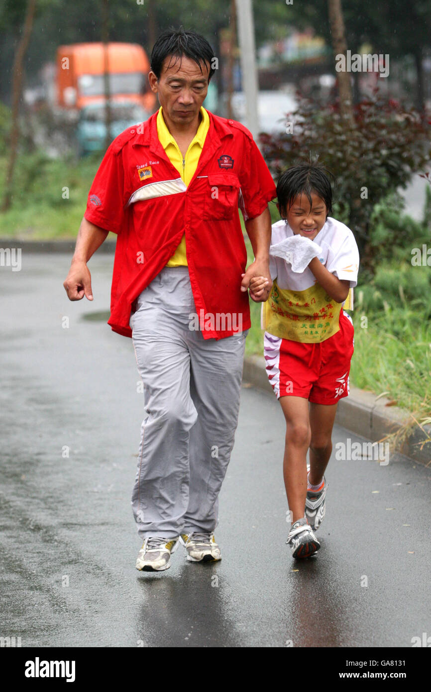 Eight-Year-Old Child Runs Across China Stock Photo - Alamy