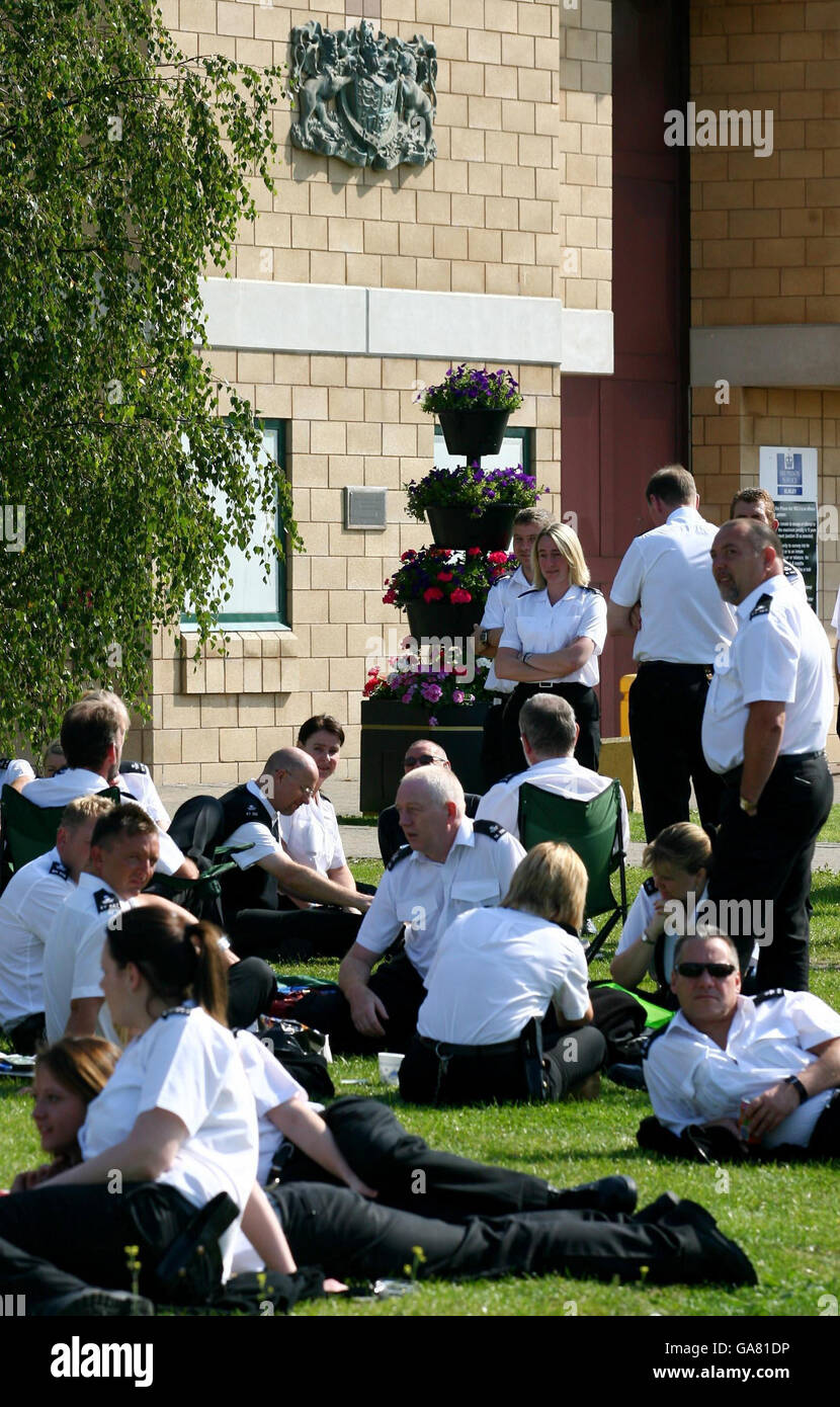 Staff outside Elmley prison, Sheerness, Kent, as thousands of prison ...