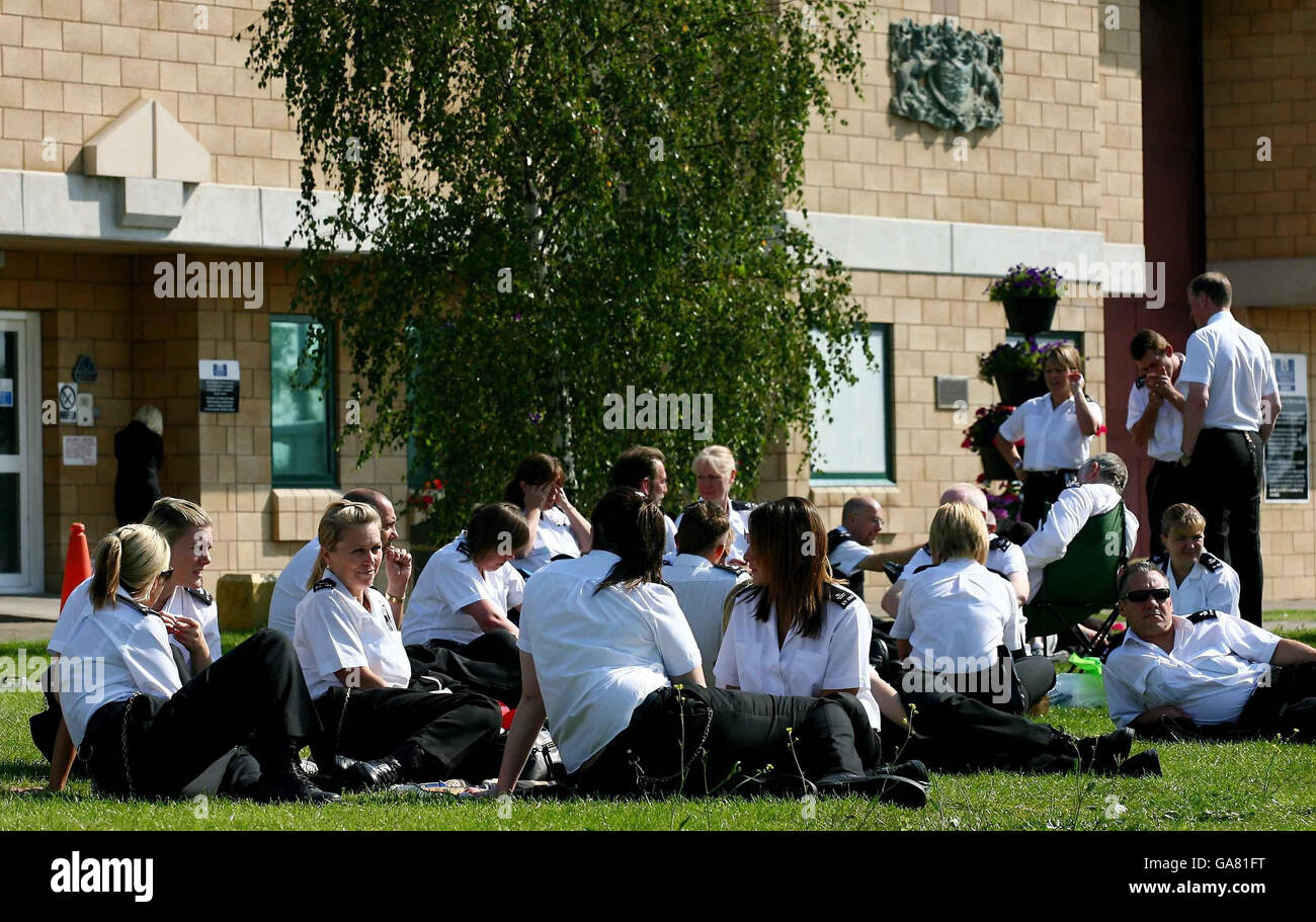 Staff outside Elmley prison, Sheerness, Kent, as thousands of prison ...