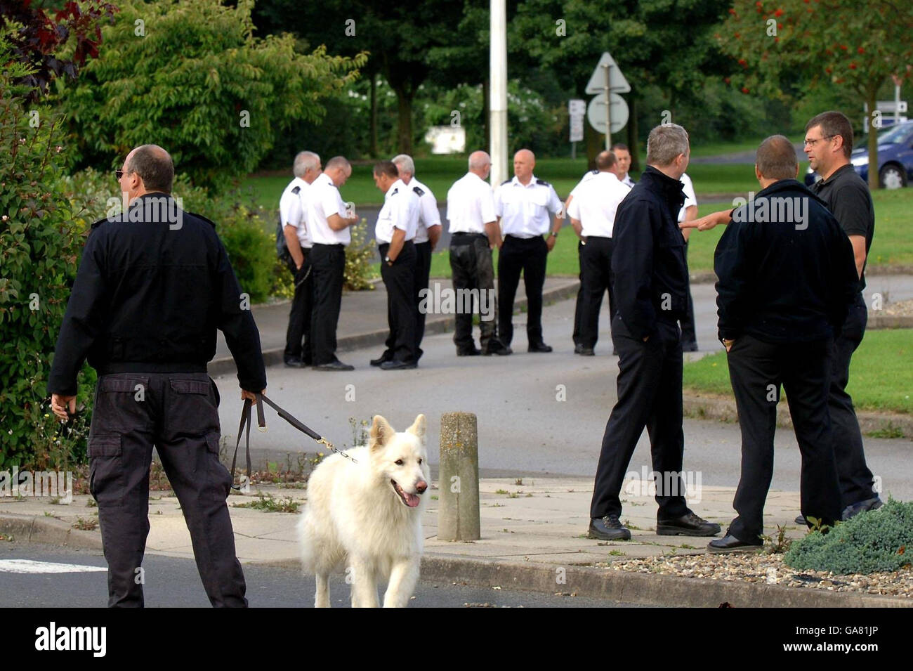 A private security dog handler patrols the grounds around Full Sutton ...