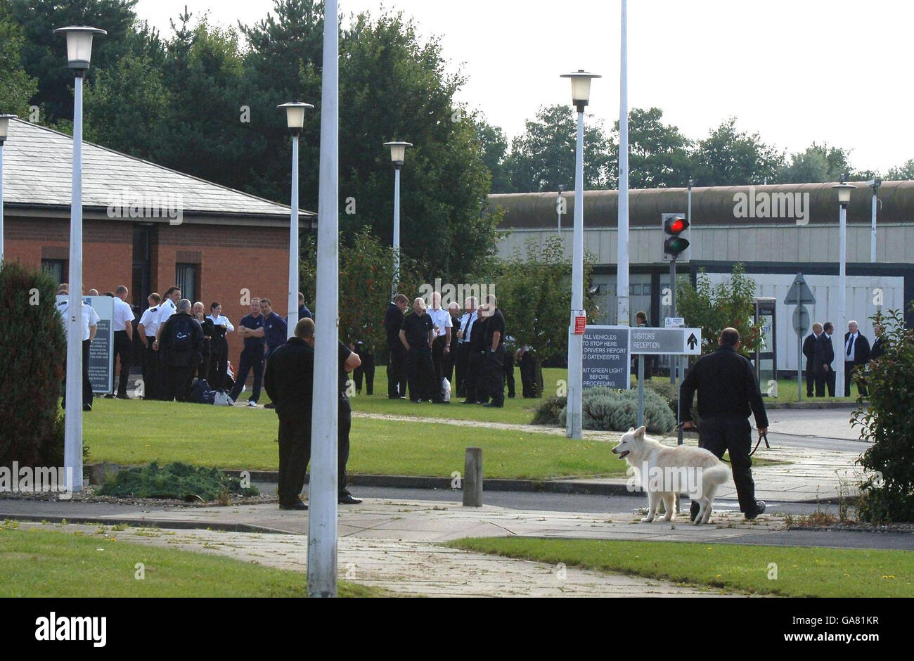 A private security dog handler patrols the grounds around Full Sutton ...