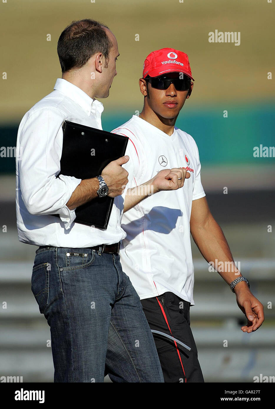 Lewis Hamilton takes a walk around with race engineer Phil Prew at the ...