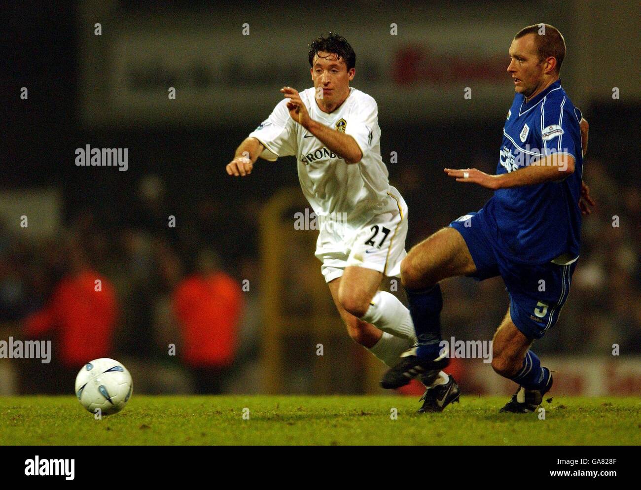 Robbie Fowler of Leeds United and Spencer Prior of Cardiff City chase ...
