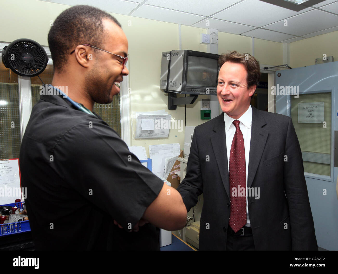 Conservative leader David Cameron talks to Dr. Dumani Kula of South ...