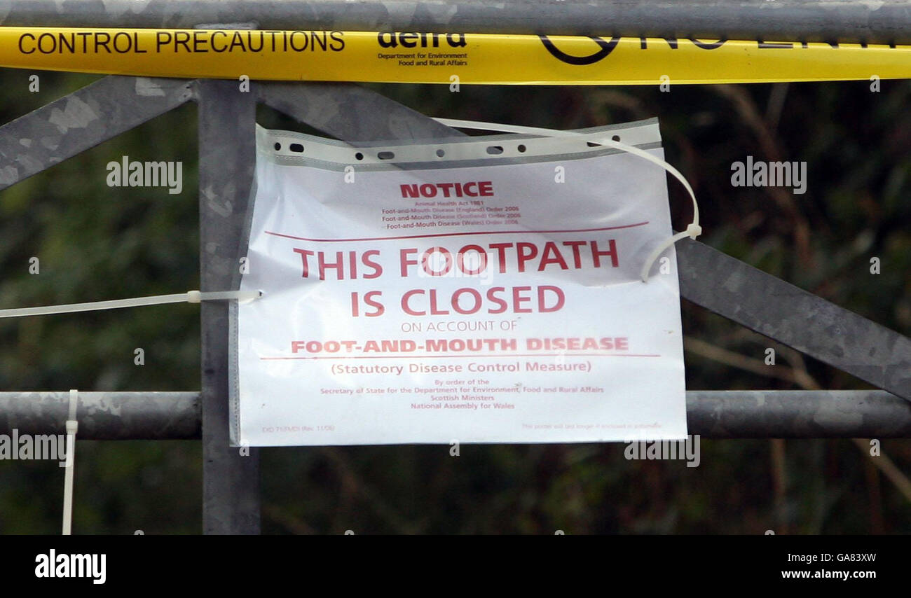 A sign at the gate of a farm near Guildford as DEFRA investigate an ...