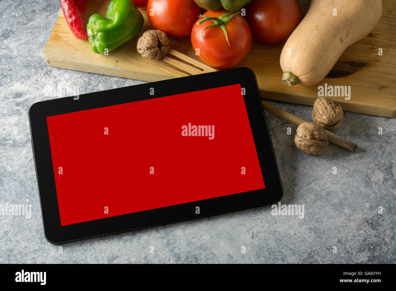 Digital tablet with fresh vegetables on white background Stock Photo ...
