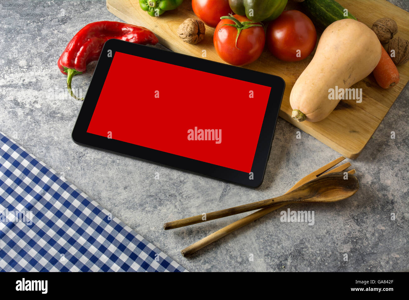 Digital tablet with fresh vegetables on white background Stock Photo ...