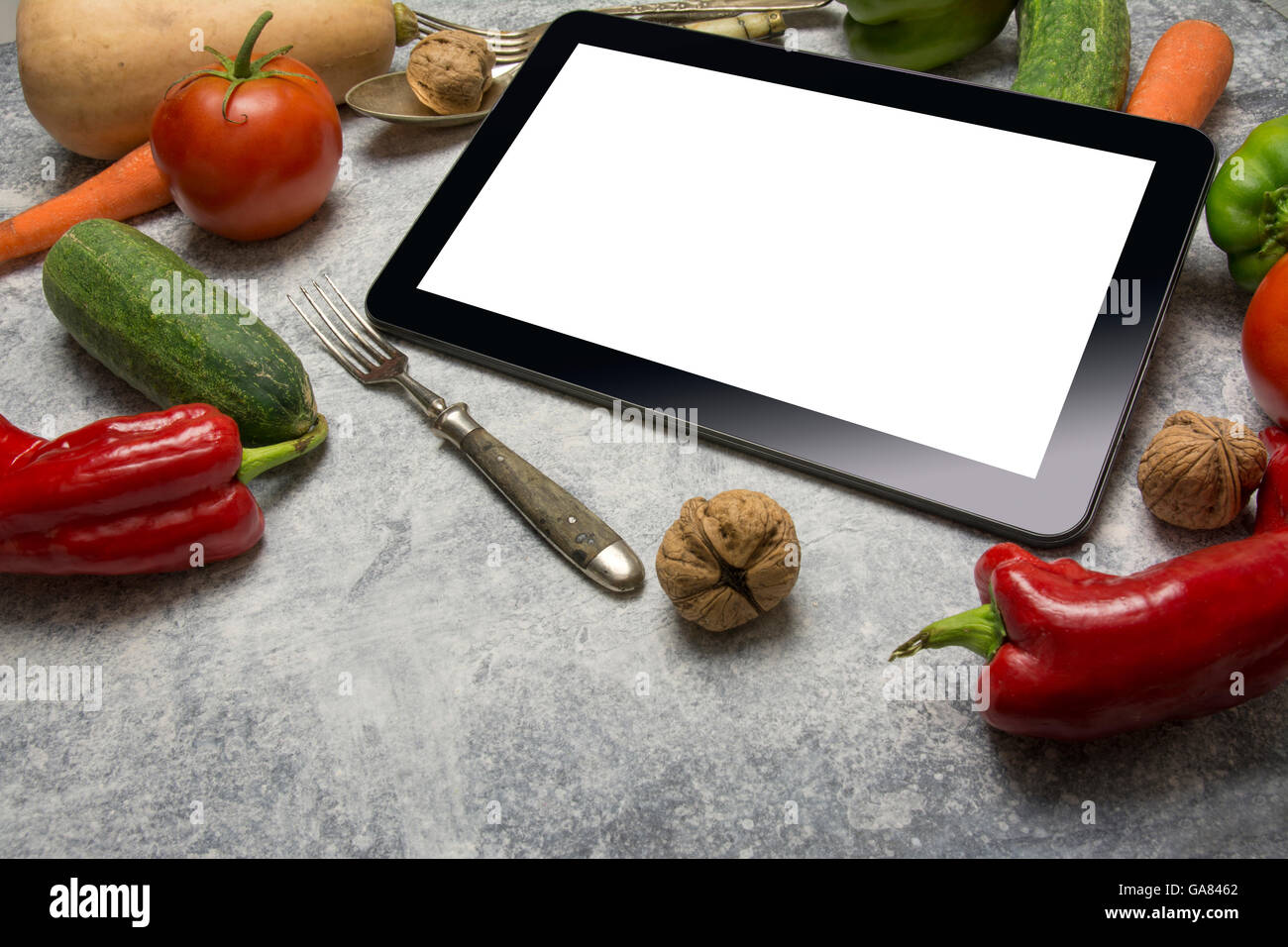 Digital tablet with fresh vegetables on white background Stock Photo ...