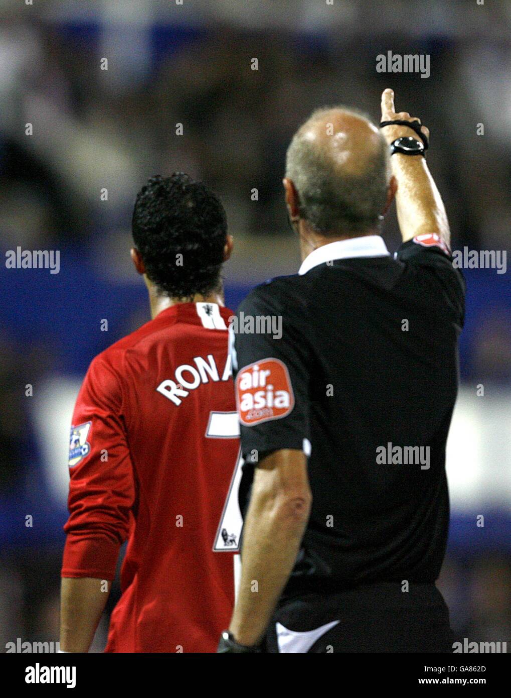 Manchester United's Cristiano Ronaldo is shown a red card by referee ...