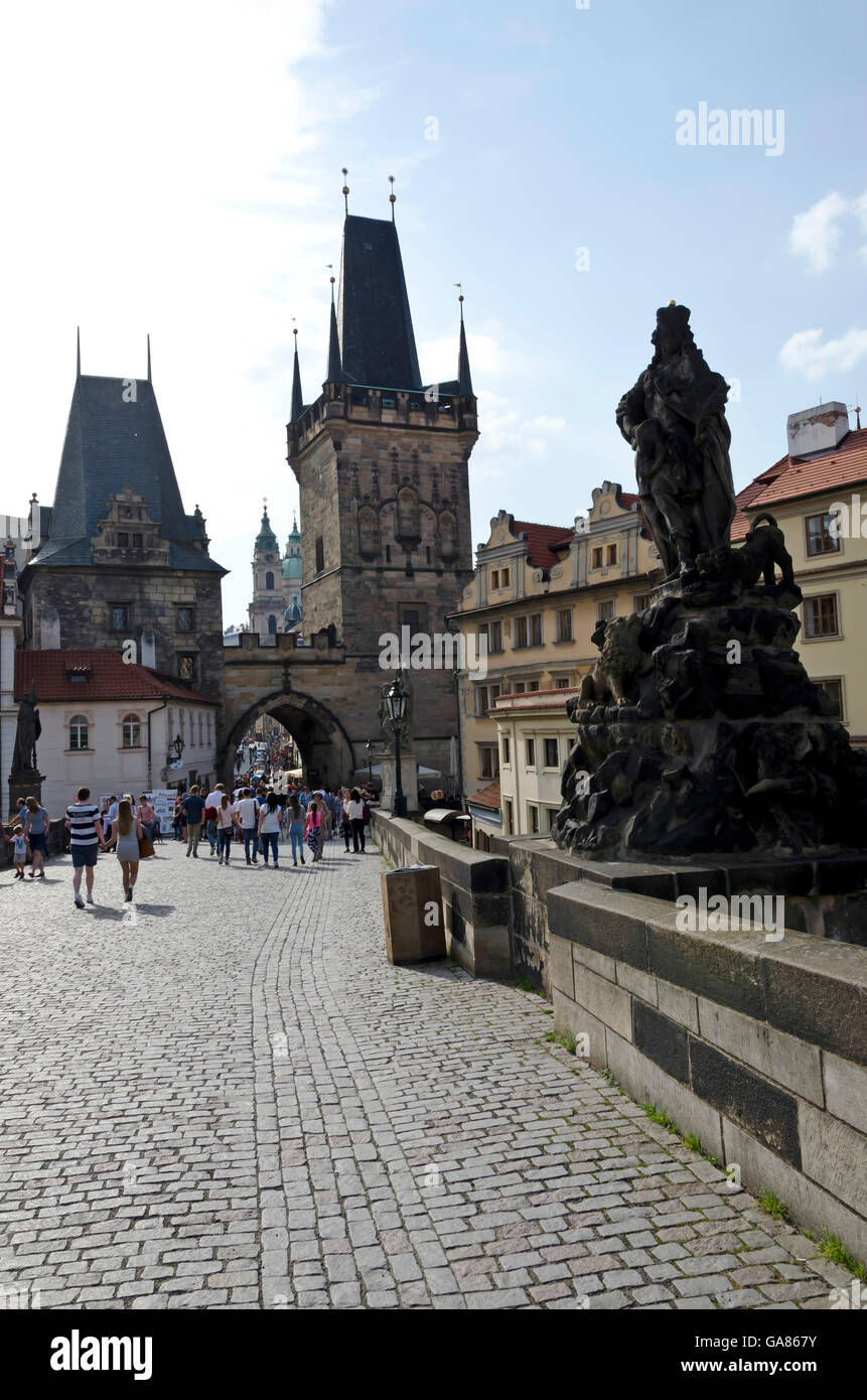 Impressive statue on the Charles Bridge (Karluv most) and the bridge ...