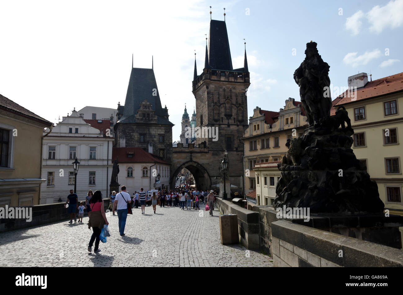 Impressive statue on the Charles Bridge (Karluv most) and the bridge ...