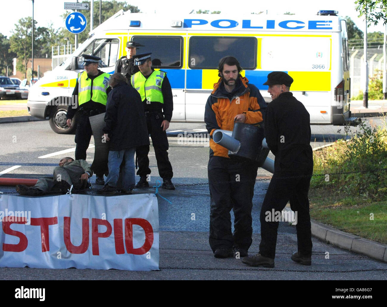 Climate change demonstrators staging a protest at Farnborough Airport ...