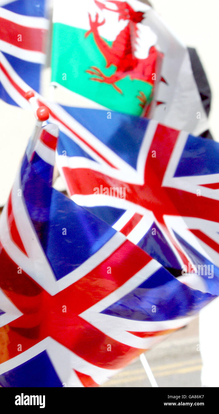 Welsh and Union flags are waved by schoolchildren. PRESS ASSOCIATION ...