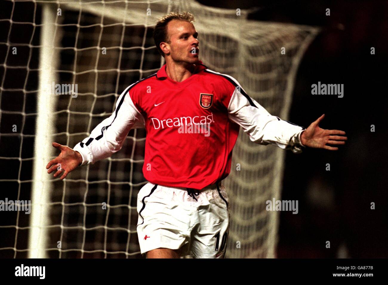Arsenal's Dennis Bergkamp celebrates scoring the winning goal against ...