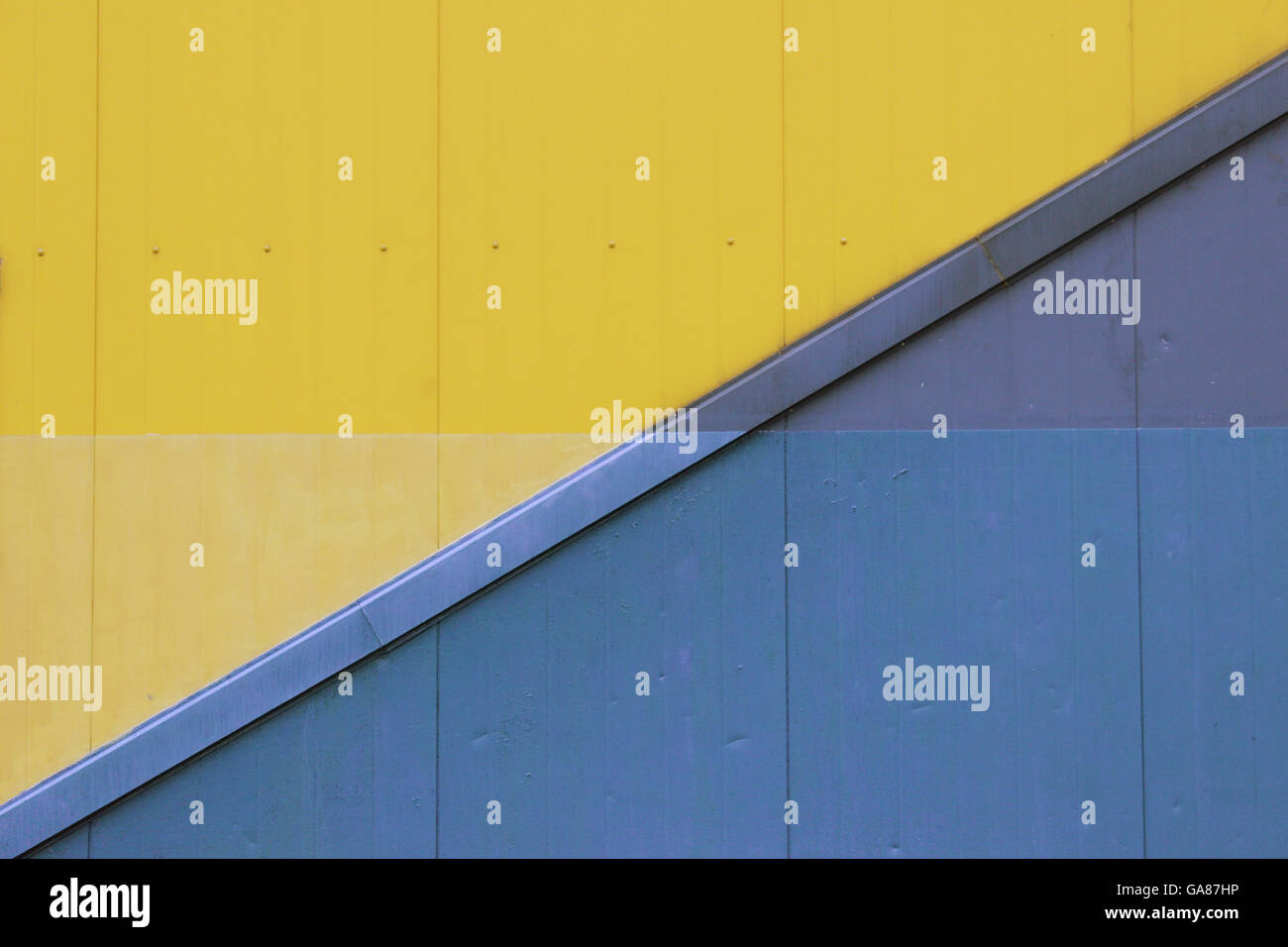 Lots of blue and yellow paint on the wall Stock Photo - Alamy