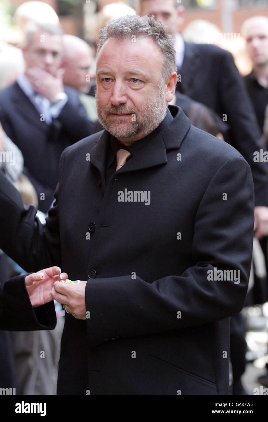 New Order band member Peter Hook arrives for the funeral of music mogul ...