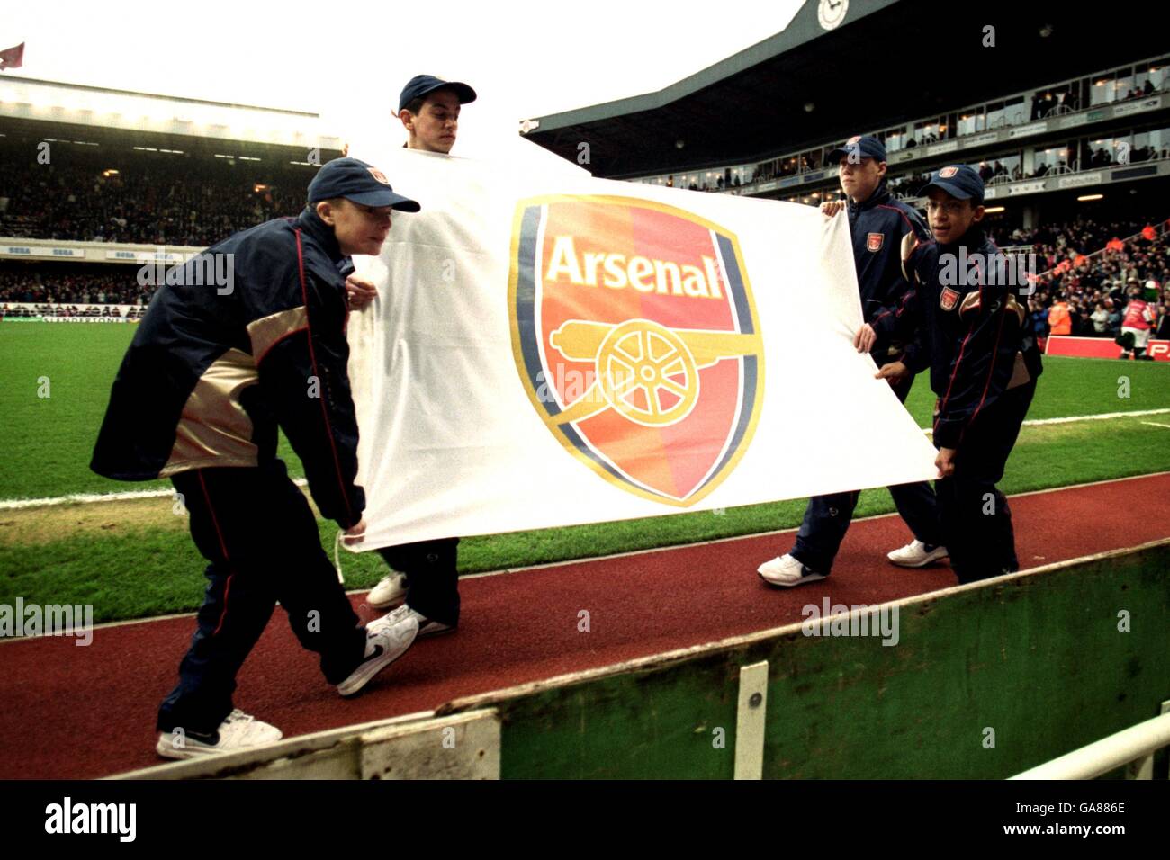 To resounding boos from the crowd, ballboys display a newly redesigned ...