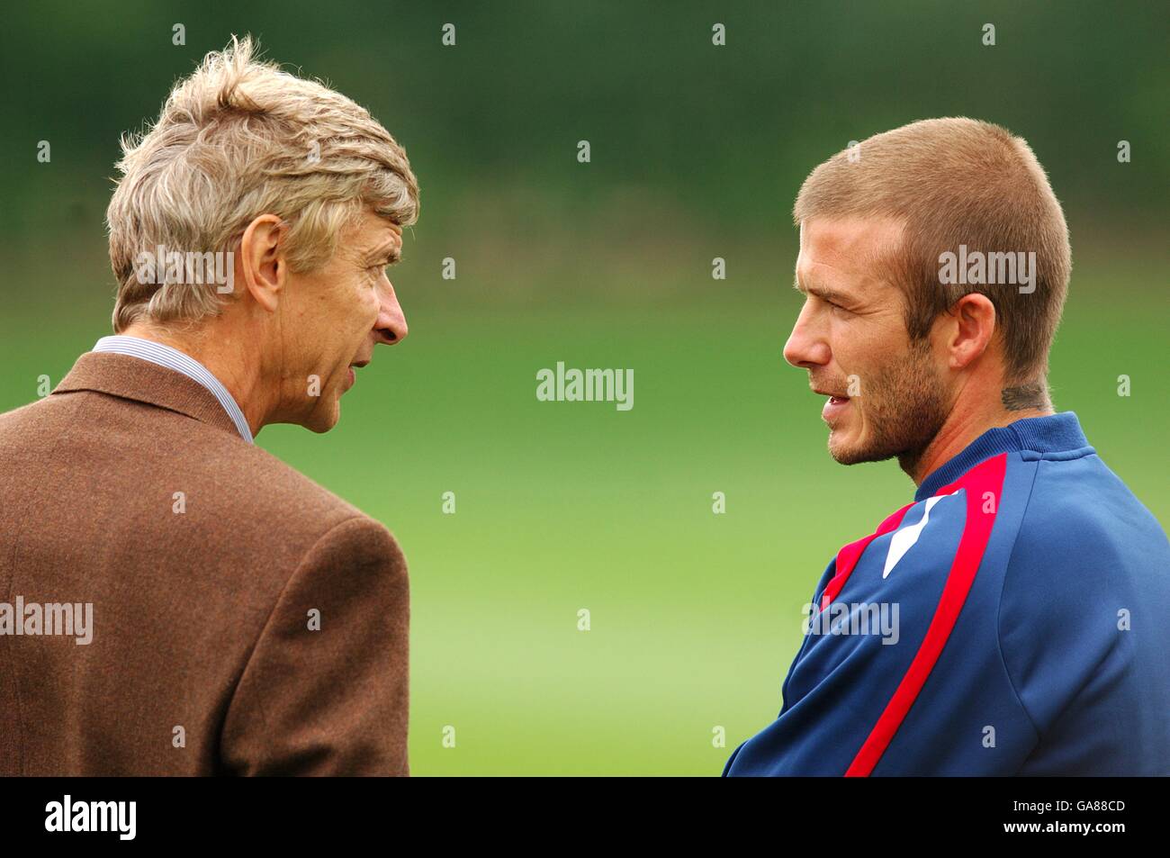 Arsenal manager Arsene Wenger and England's David Beckham talk during ...