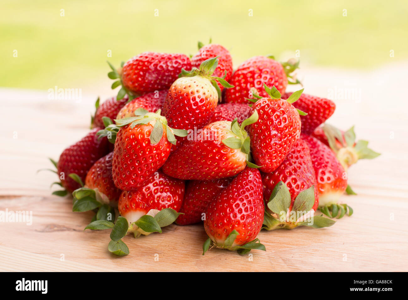 strawberries on garden's table, outdoor picture Stock Photo - Alamy