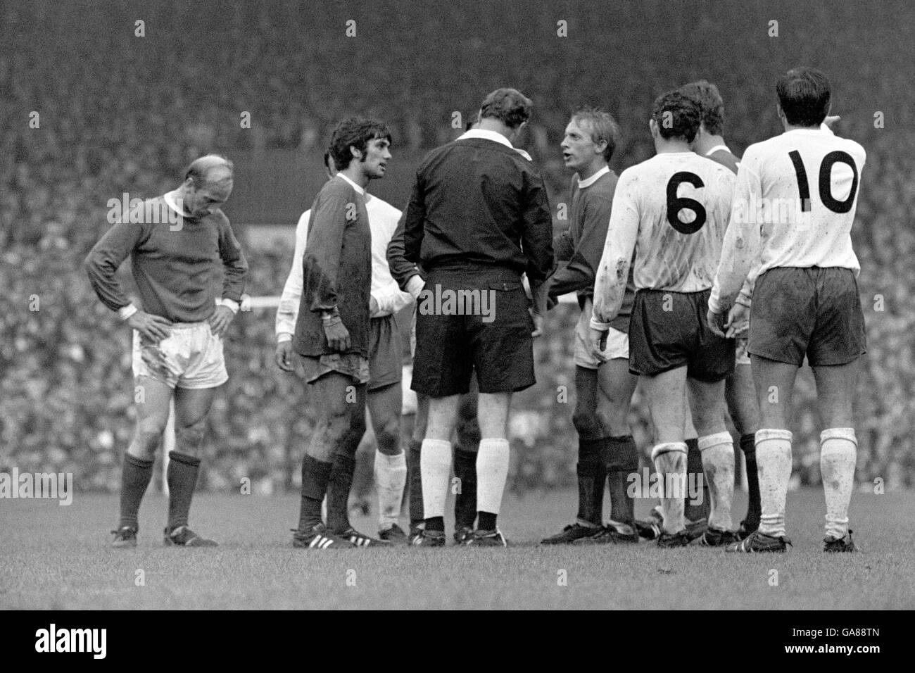 Referee Mr E.J Jennings talks to the players after an incident ...