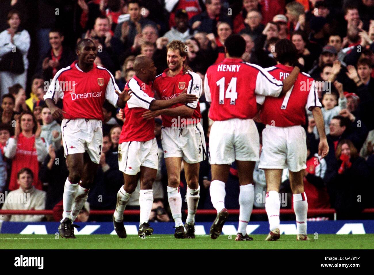 Arsenal's Tony Adams celebrates with his team mates after scoring the ...