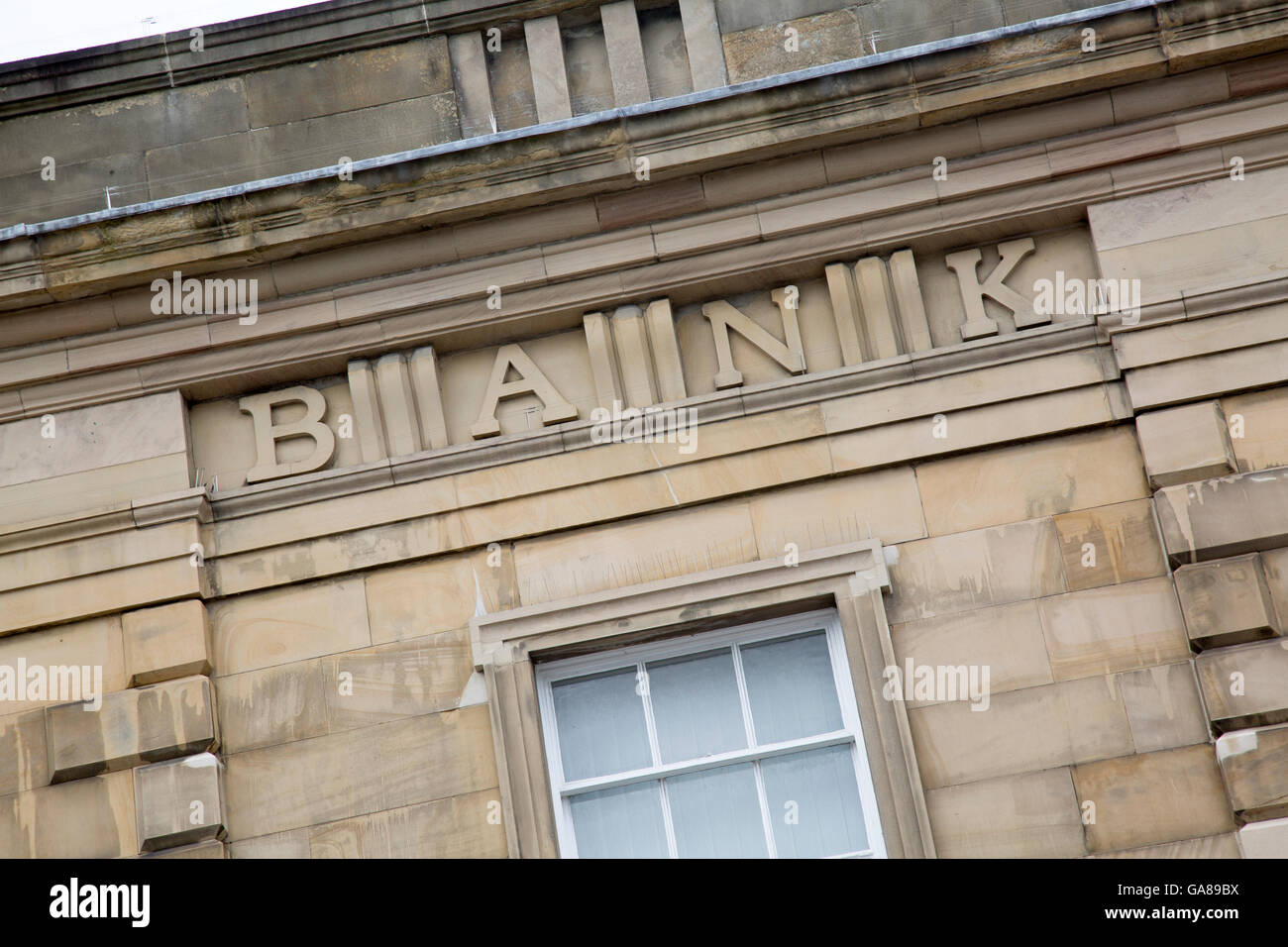 Bank Sign on Stone Facade Stock Photo - Alamy