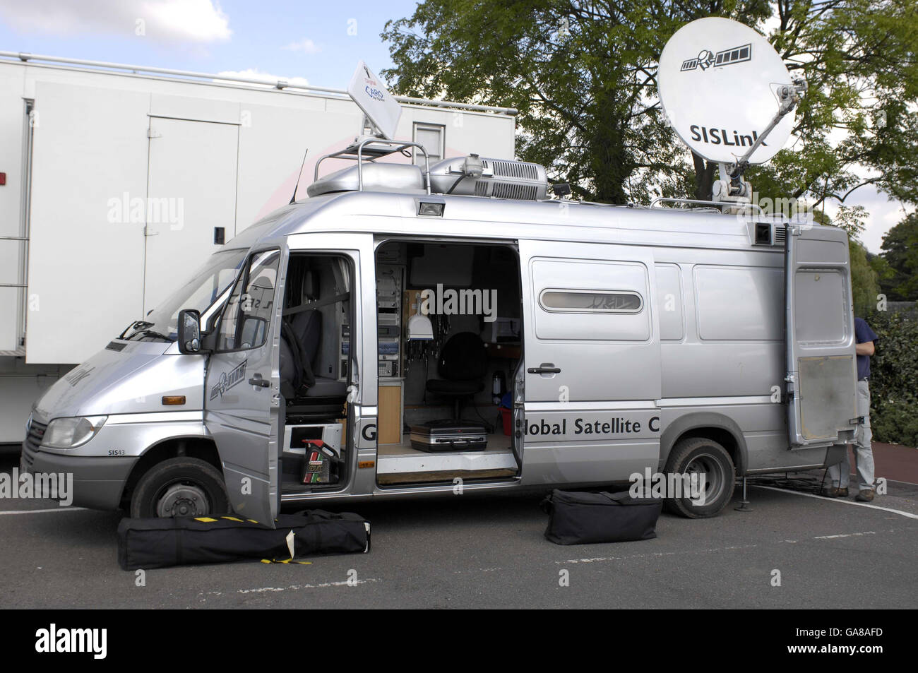 TV broadcast vehicles. A SIS Van at Kempton Racecourse Stock Photo - Alamy