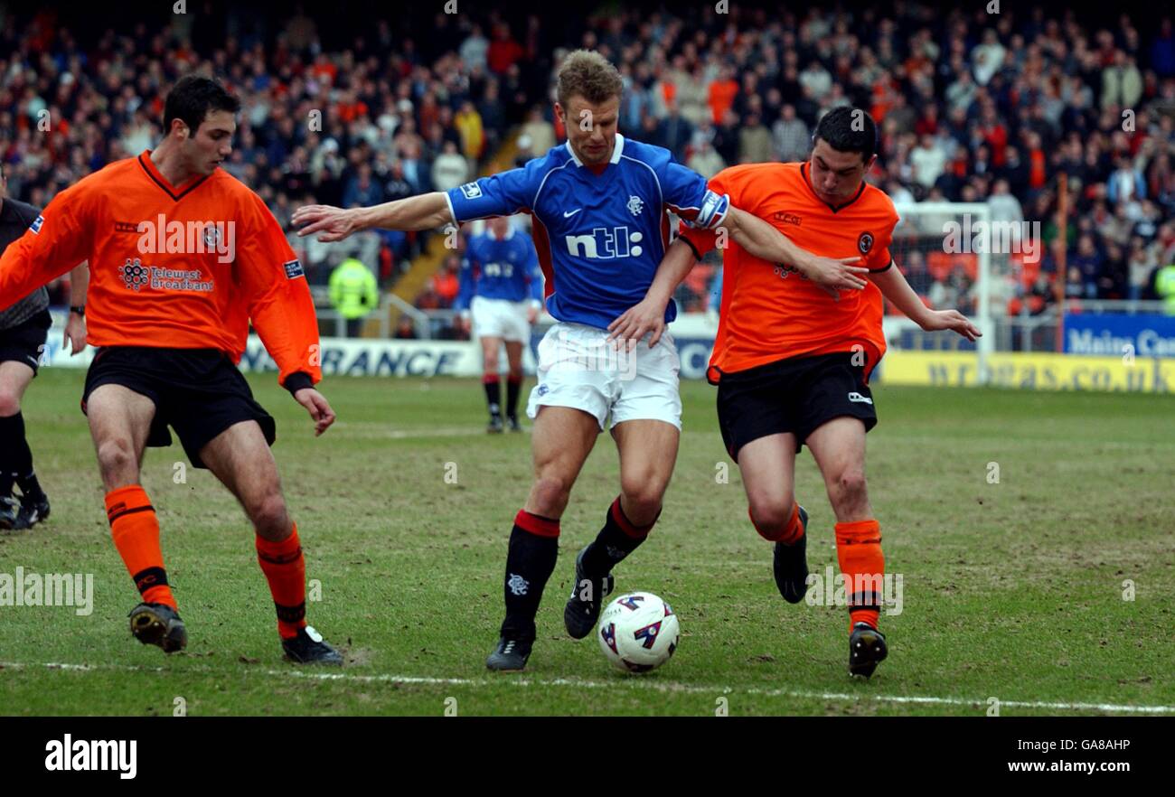 Dundee United's Tassos Venetis (l) and Charlie Miller (r) try to ...