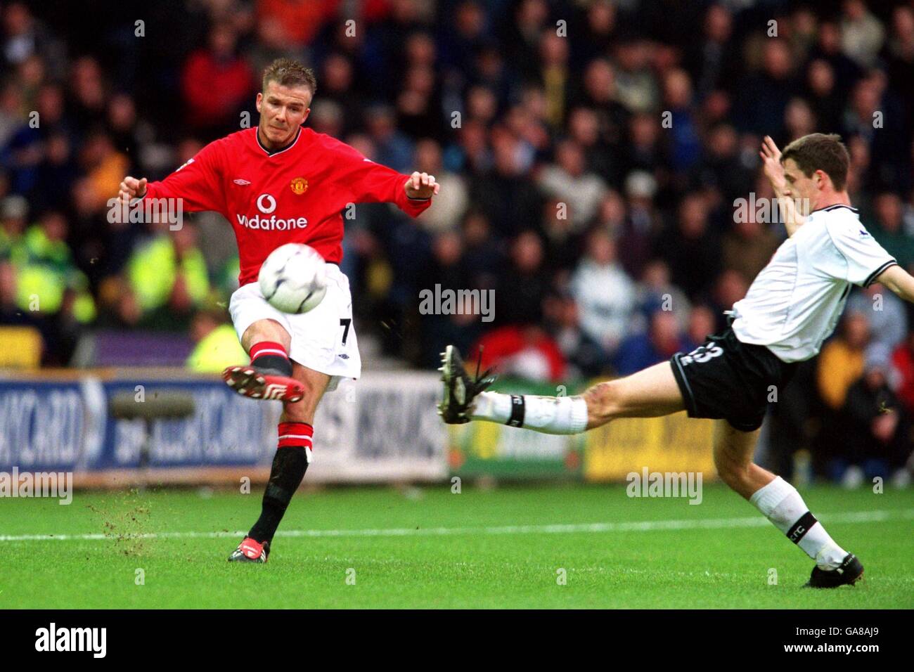 Manchester United's David Beckham gets a cross in as Derby County's ...