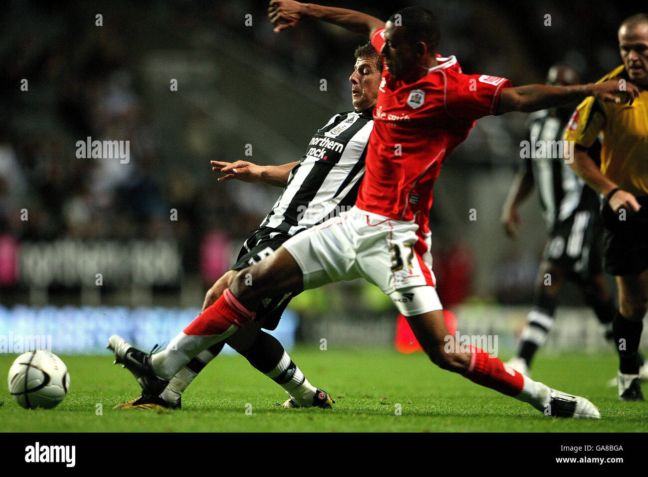 Newcastle united right battles for the ball hi-res stock photography ...