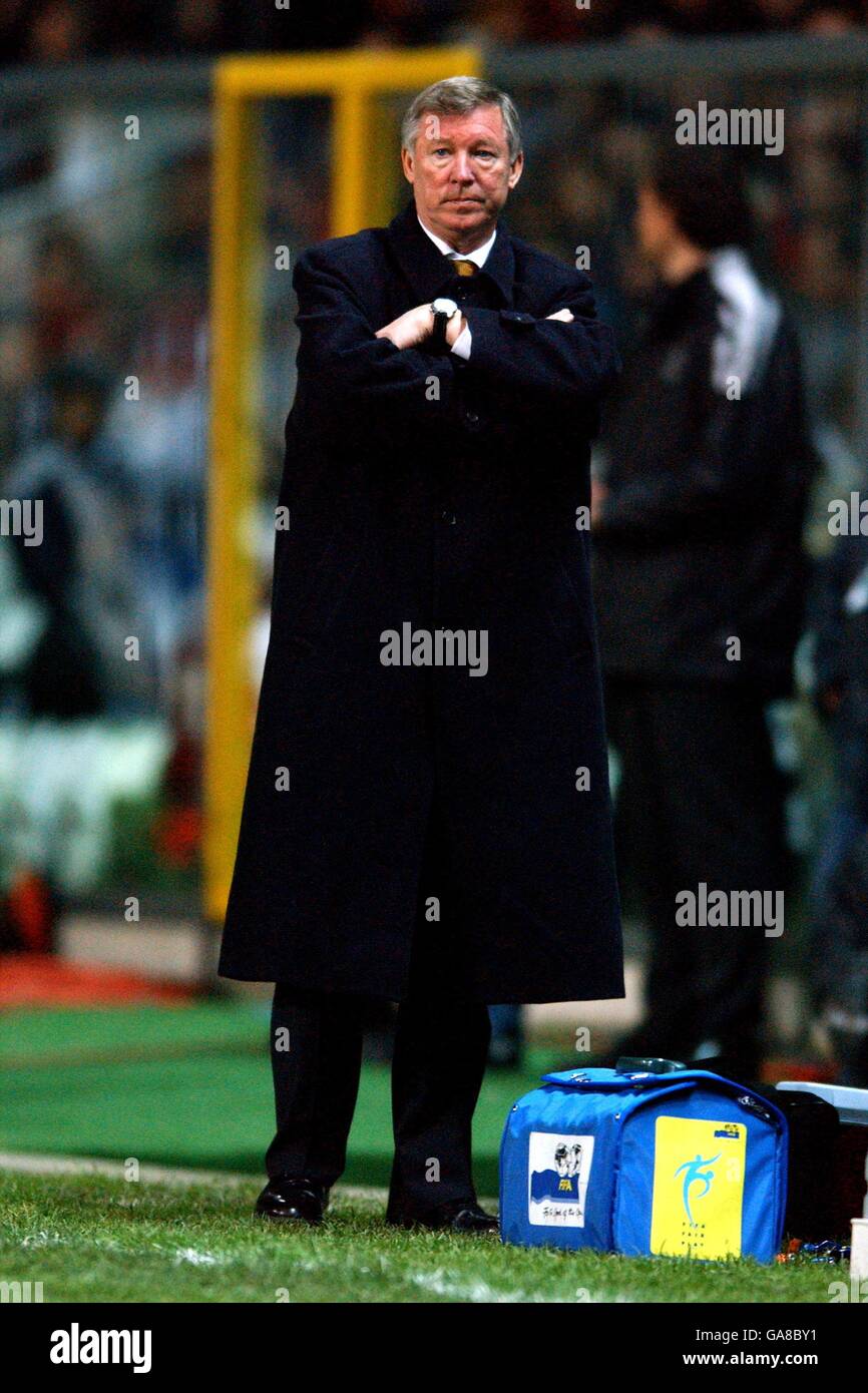 Manchester United's manager Sir Alex Ferguson watches emotionless as ...