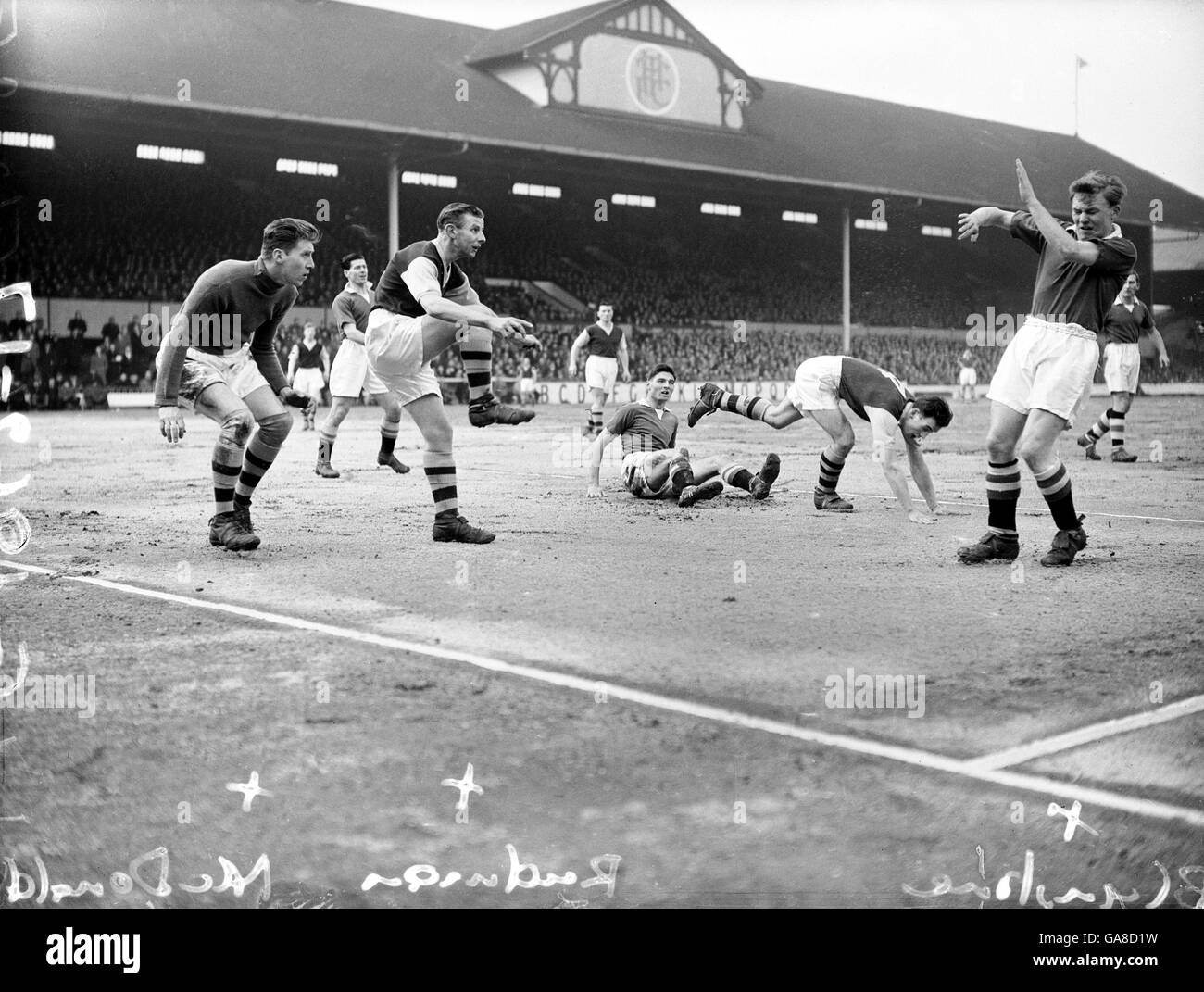 Chelsea's Frank Blunstone (r) covers his face as Burnley's Harold ...