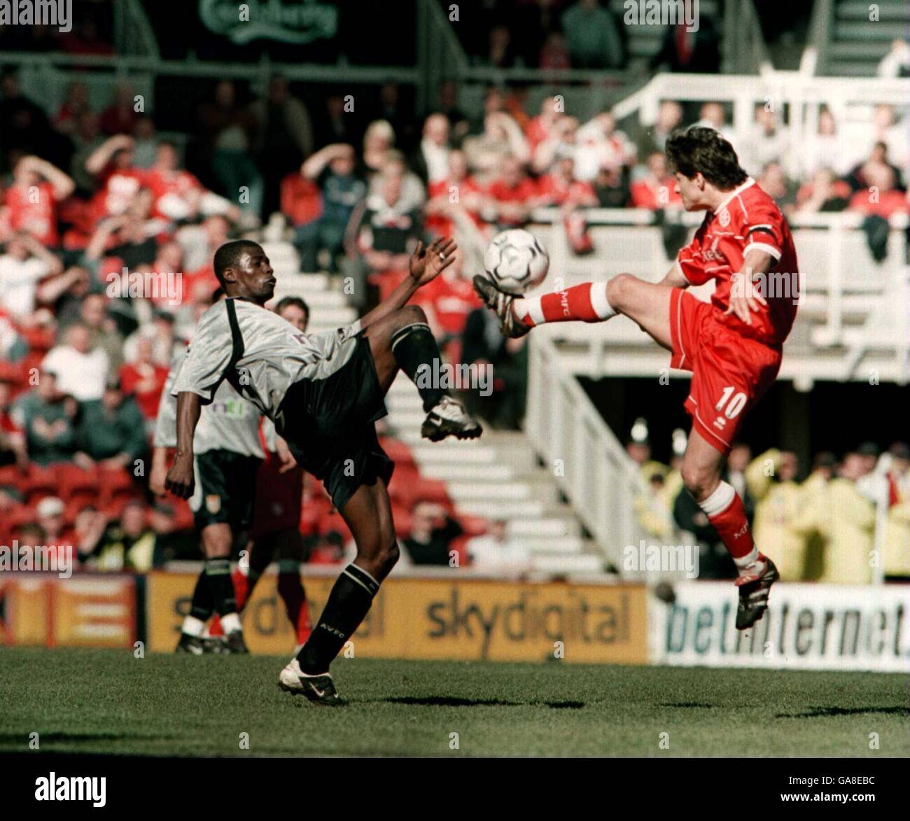 Middlesbrough's Benito Carbone gets a high challenge with Aston villa's ...