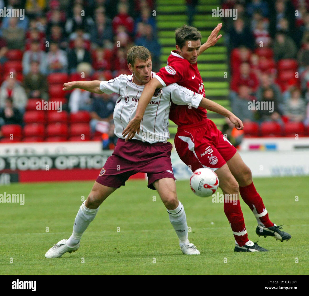 Aberdeen's Lee Mair in action with Hearts' Kestutis Ivaskevicius during ...