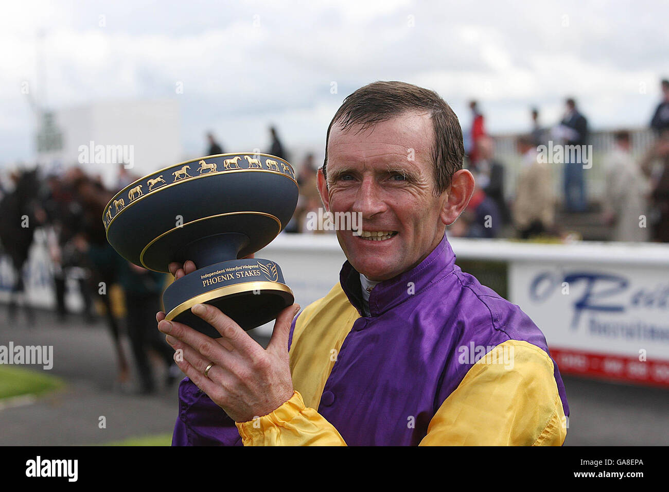 Jockey Kevin Manning with the trophy after winning The Independent ...
