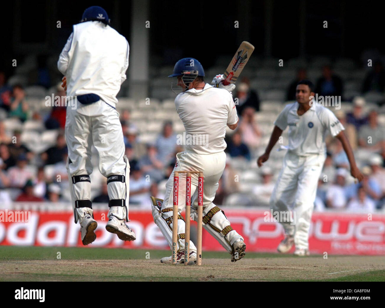 Cricket action bowling jumping hi-res stock photography and images - Alamy