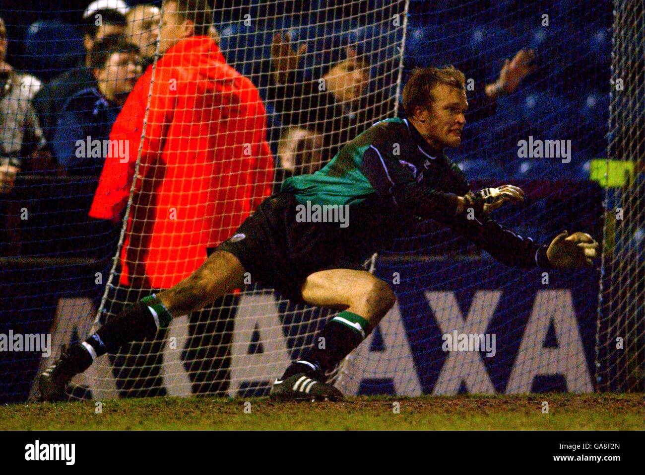 Bolton Wanderers' goalkeeper Jarni Viander tries in vain to stop a late ...