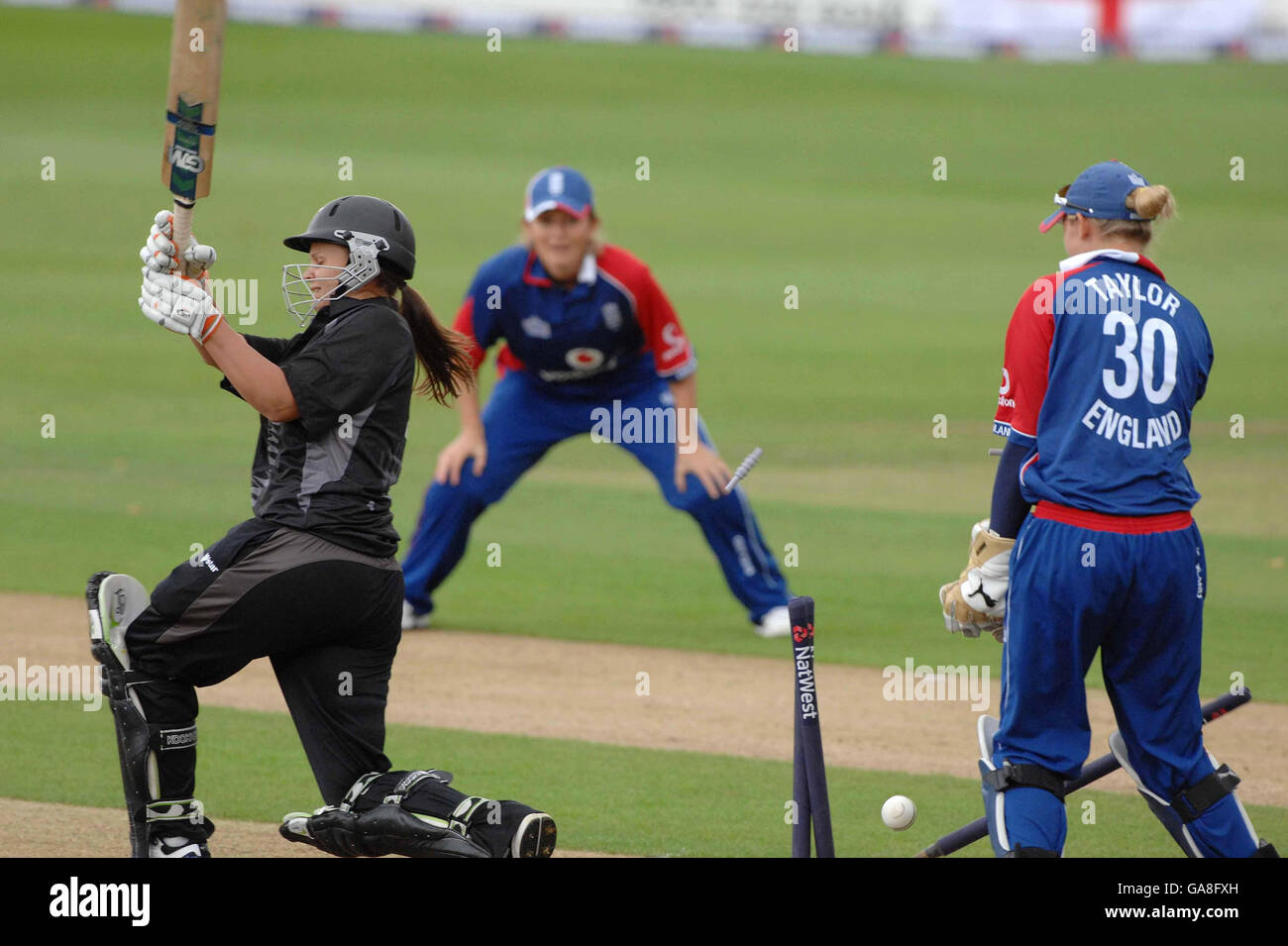 New Zealand's Suzie Bates (left) looses her wicket to the bowling of ...