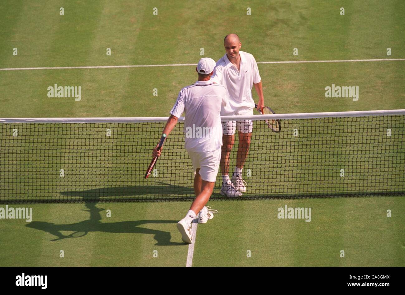 Andre Agassi (top) shakes hands with Peter Wessels (bottom) after ...