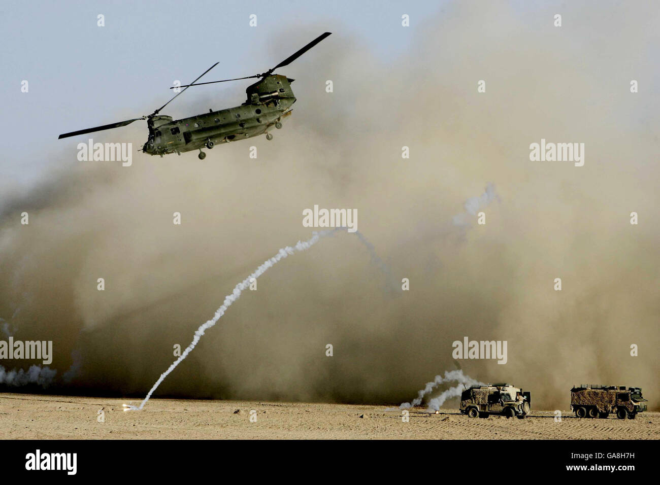 A Chinnock helicopter fires chaff as it takes off from Camp Sandford ...