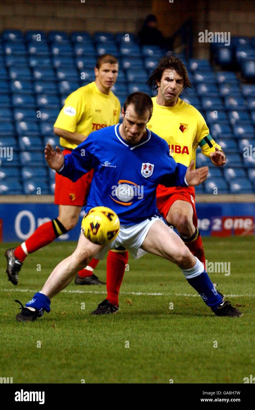 Millwall's Steve Claridge (l) controls the ball under pressure Watford ...
