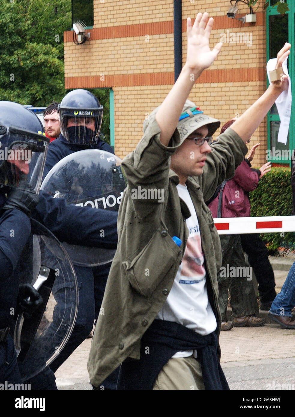 A climate change demonstrater is moved by a riot policeman outside the ...