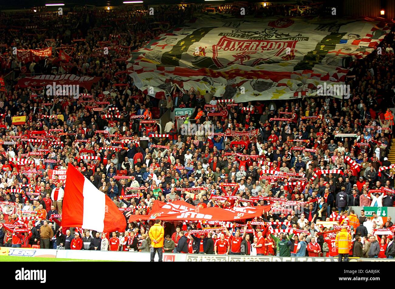 Liverpool fans cheer on team from stands hi-res stock photography and ...