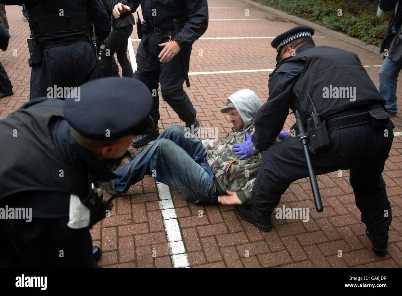 Police restrain protestors from the climate change camp who are ...