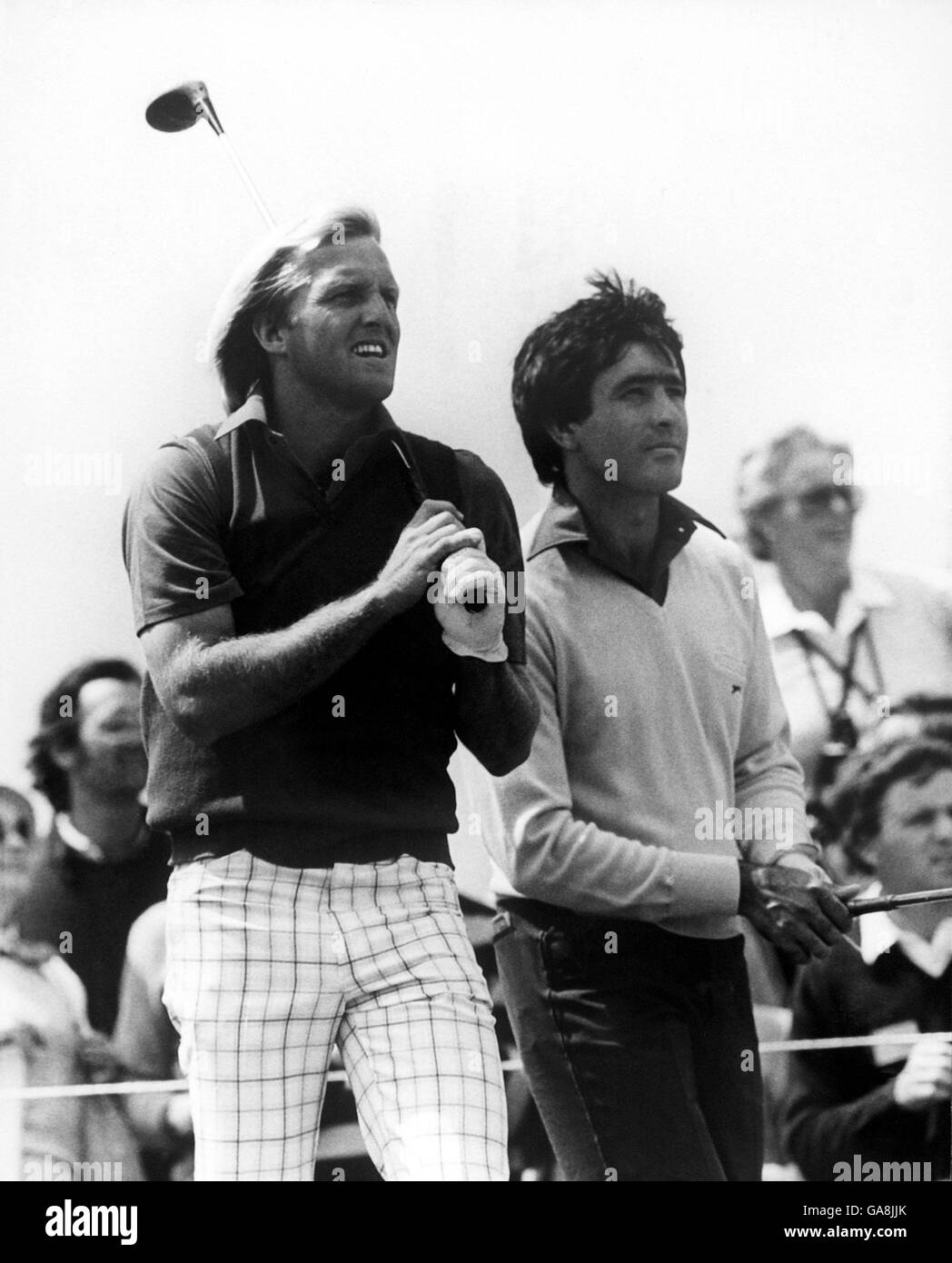 (L-R) Greg Norman and Severiano Ballesteros watch Norman's drive from ...