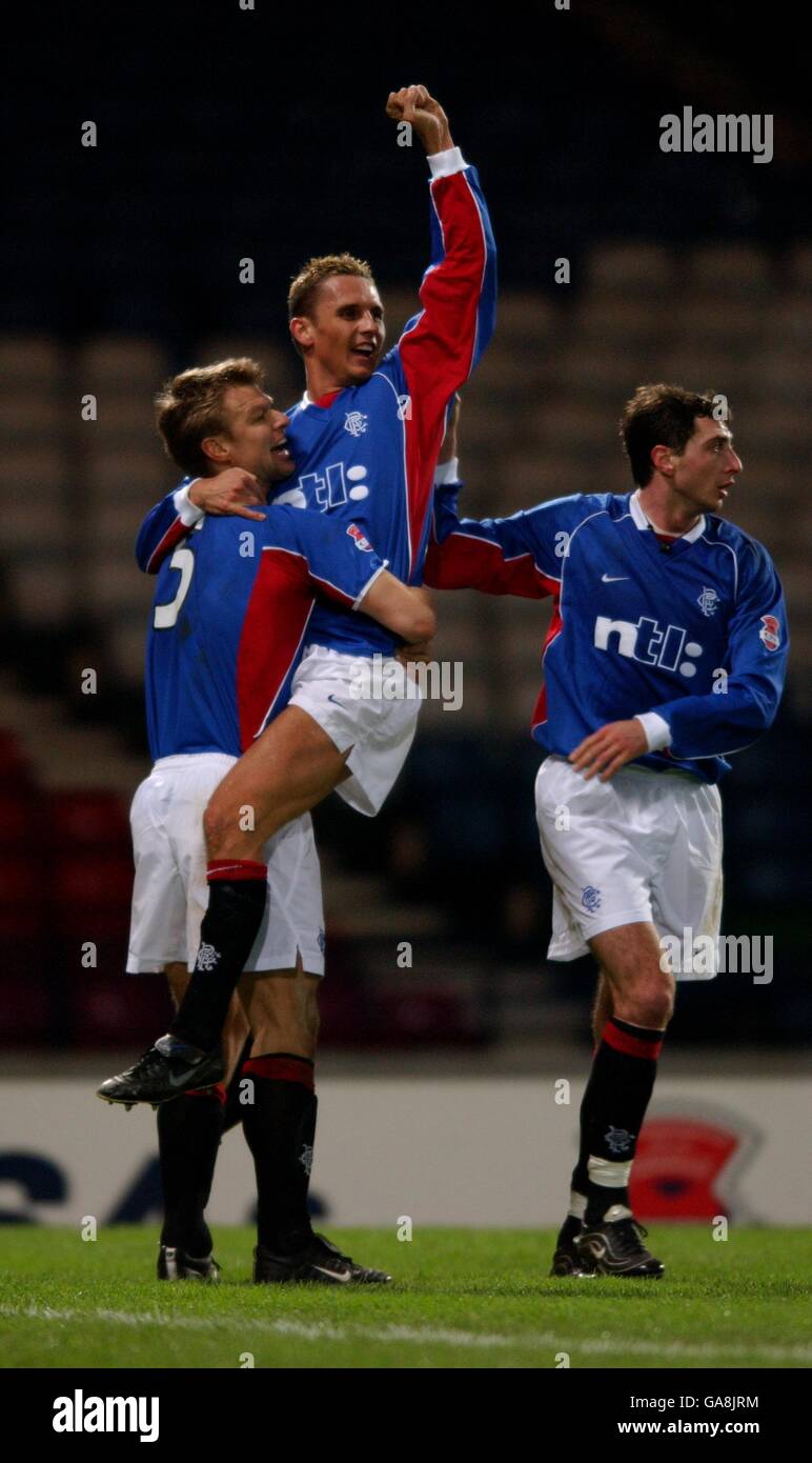 Rangers' Peter Lovenkrands celebrates with Arthur Numan and Shota ...