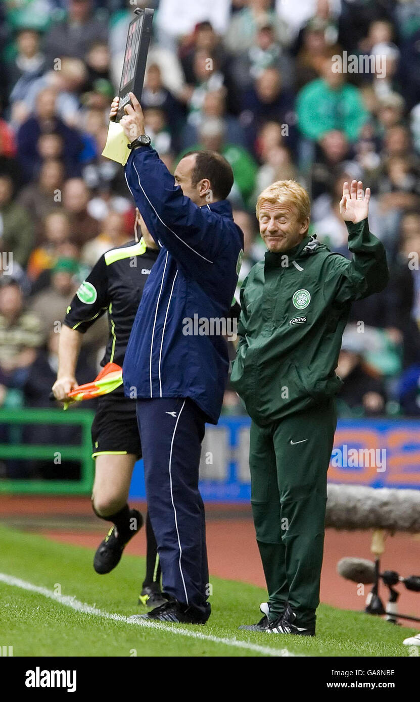 Celtic manager Gordon Strachan acknowledges the fans as they chant his ...