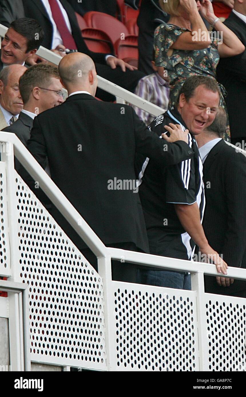 Newcastle United's owner Mike Ashley shares a joke with colleagues ...